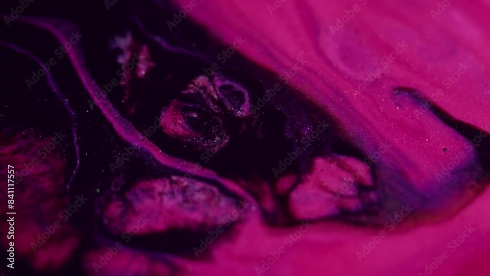 Ink spill. Sparkling paint flow. Defocused pink purple black color ...