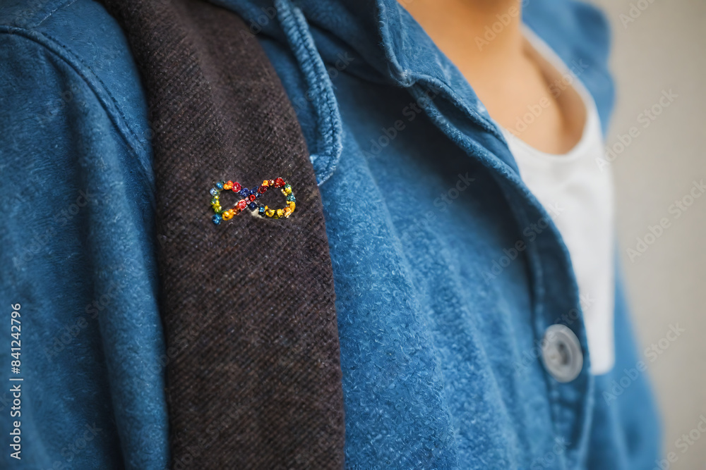 Young boy with autism infinity rainbow symbol sign. World autism ...