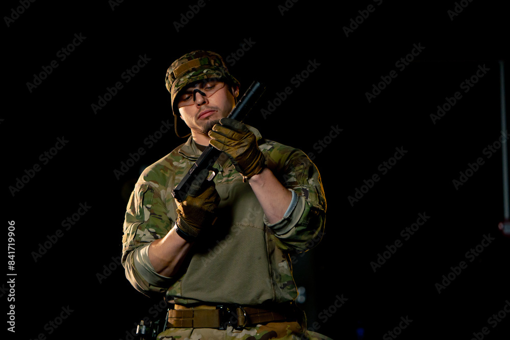 at a professional shooting range a military weapons trainer standing ...