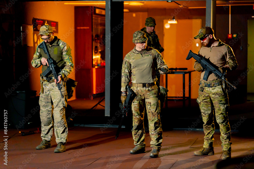 at a professional shooting range military trainers perform tactical ...