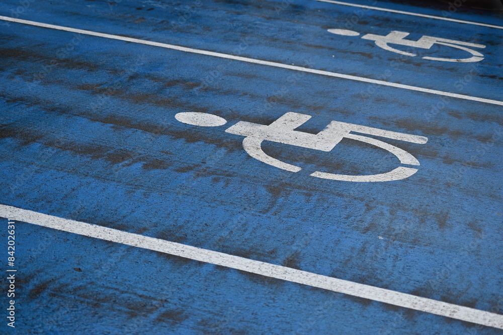 blue disabled parking sign as background, disabled parking sign on ...
