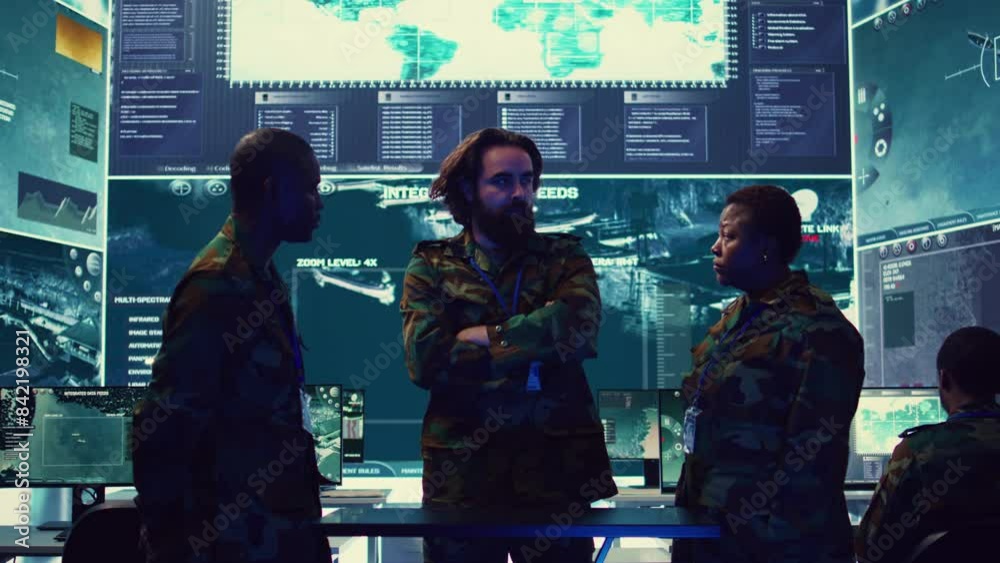 Brigadier general and his staff studying radar data on a holographic ...