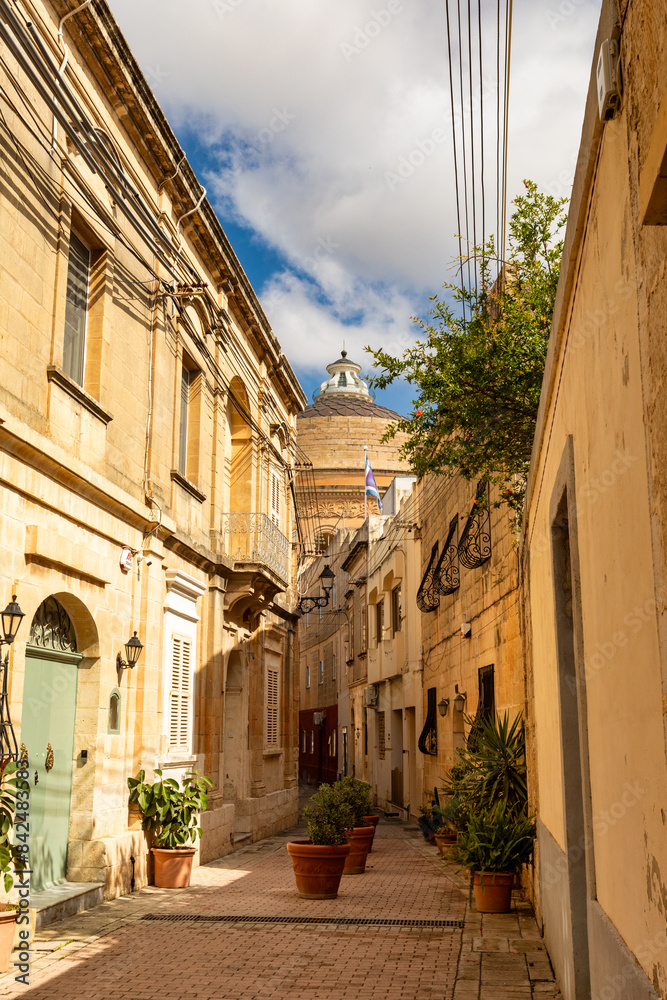 Narrow, winding alleyway in Mosta ancient core reveals historic ...