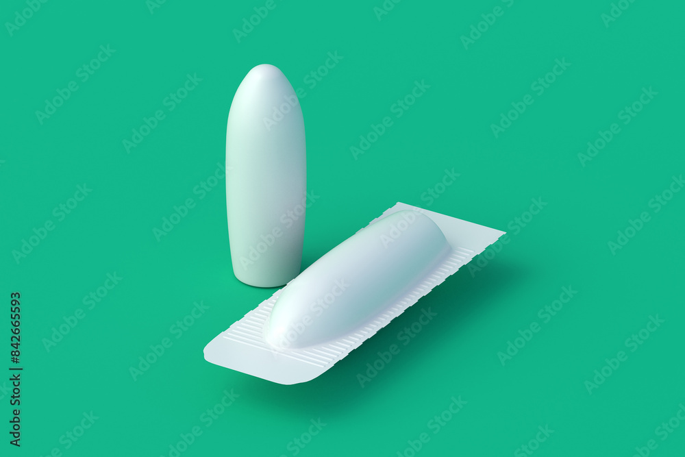 Suppositories for vaginal or anal use on green background. Candles for ...