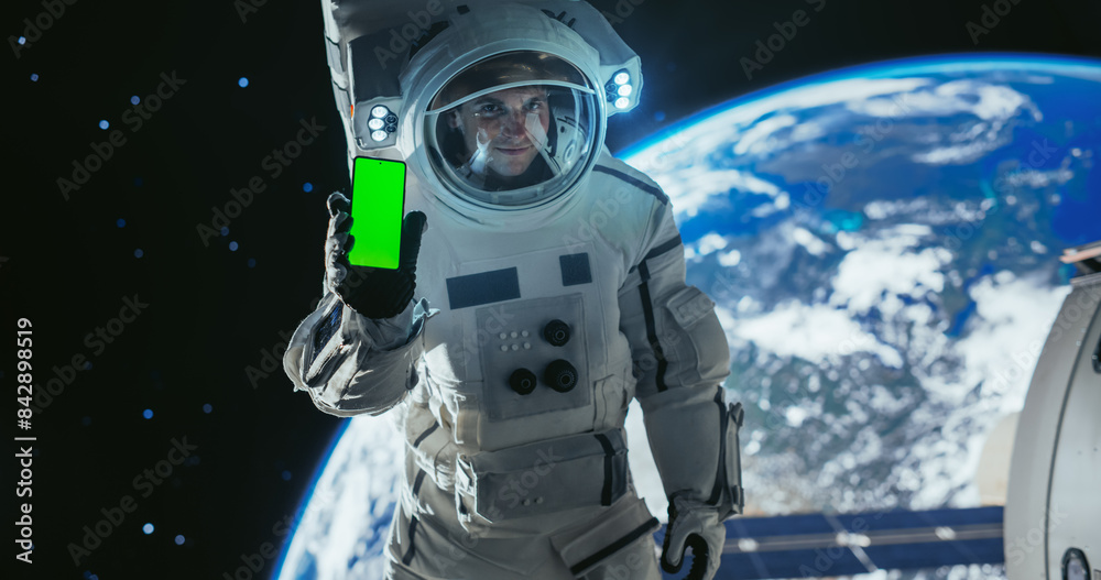 Young Astronaut Floating in Space in Zero Gravity. Spaceman Showing a ...
