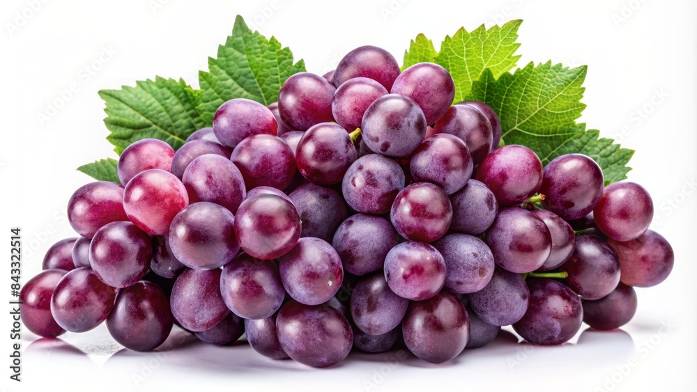 Fresh, luscious, and juicy, a vibrant cluster of purple grapes hangs ...