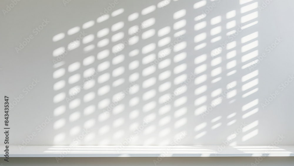 A photo of vertical striped shadows on a white wall, with soft shadow ...