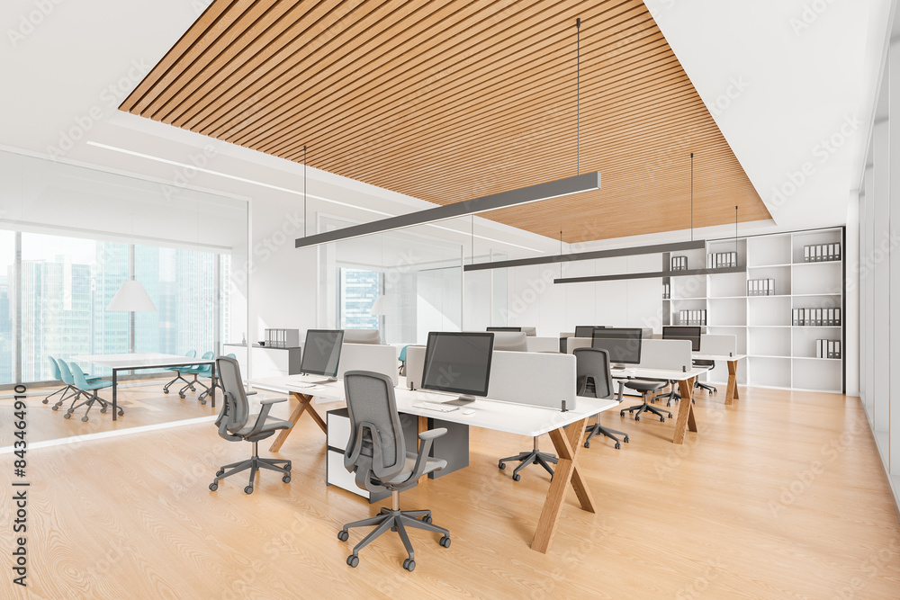 Modern open office space with workstations, wood panel ceiling, and ...
