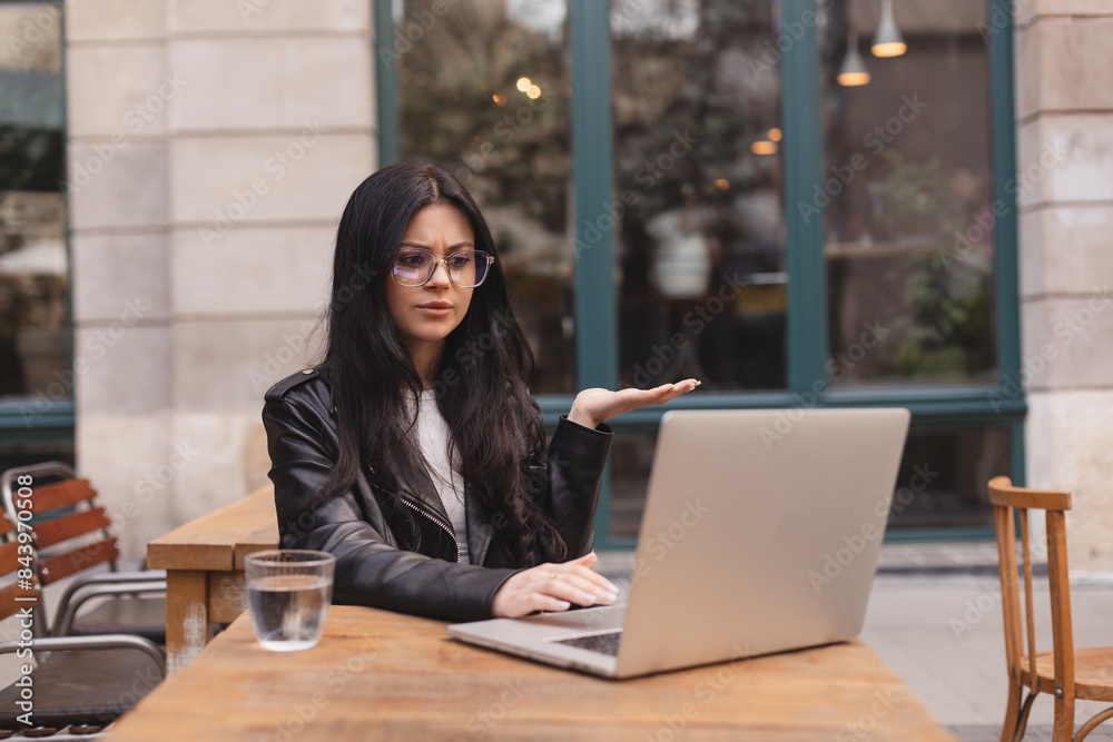 Stressed angry woman talking by video link arguing with colleagues ...