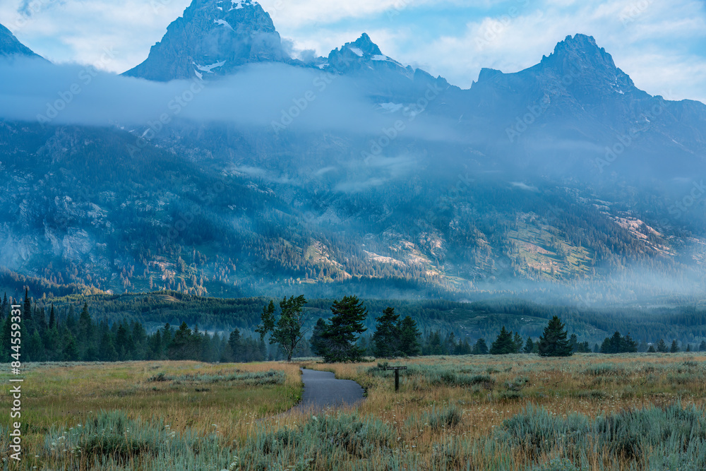 Fog and rising sun lighting the Grand Teton National Park - Windy Point ...