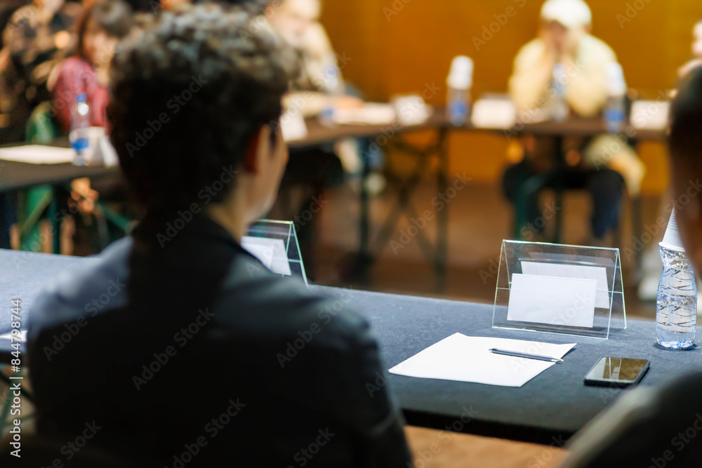 Attendee at a formal conference table in a large meeting room Stock ...
