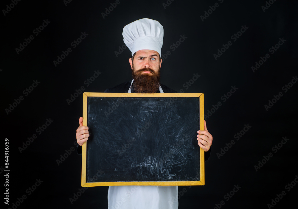 Chef showing empty menu blackboard with copy space for text. Recipe ...