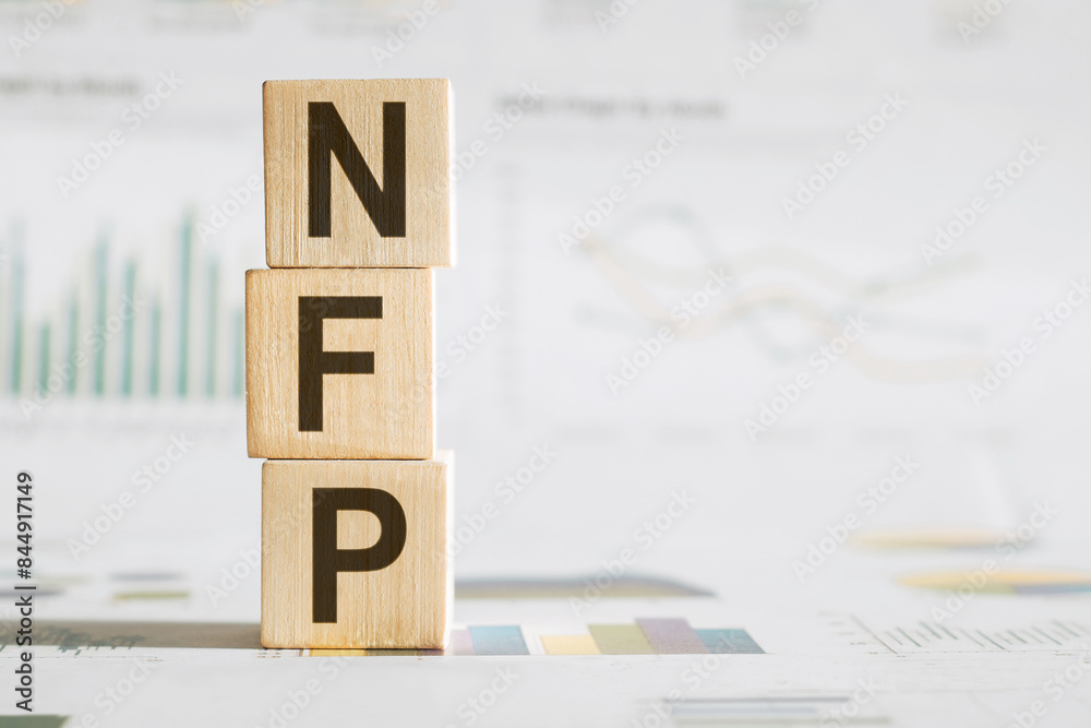 Word NFP - Non Farm Payrolls - acronym concept on cubes and diagrams on ...