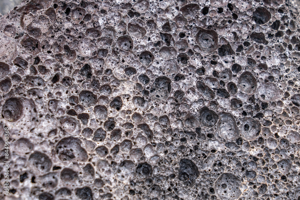 Vesicular texture is a volcanic rock texture characterized by a rock being pitted with many ...