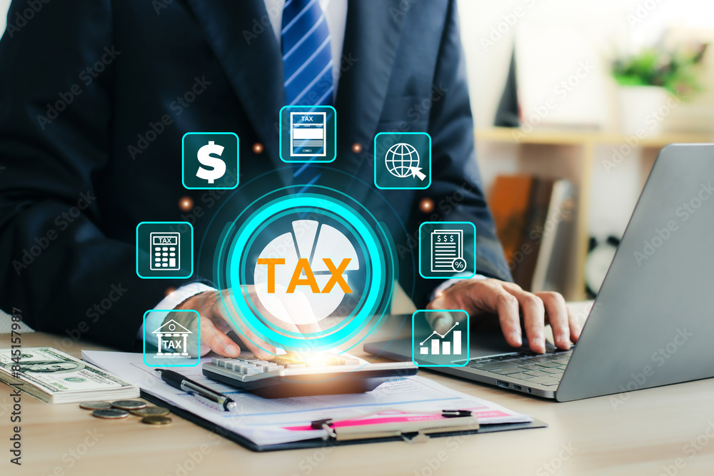 Calculation tax return concept. Businessman is working on his taxes ...