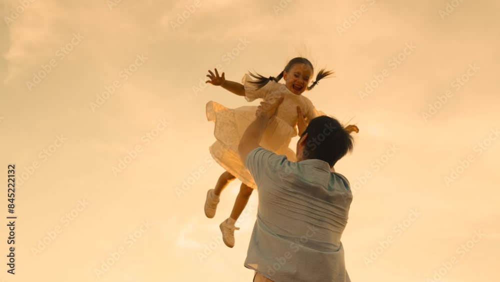 father throws child kid daughter into sky, silhouette happy family ...