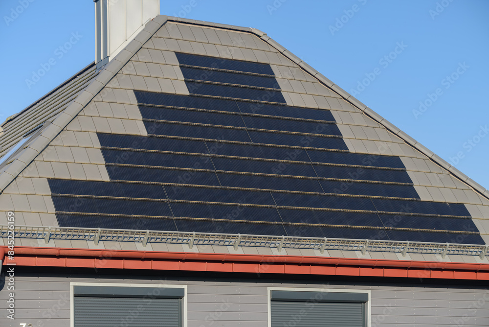 High-tech solar roof tiles on roof as solar power plant. Solar shingles ...