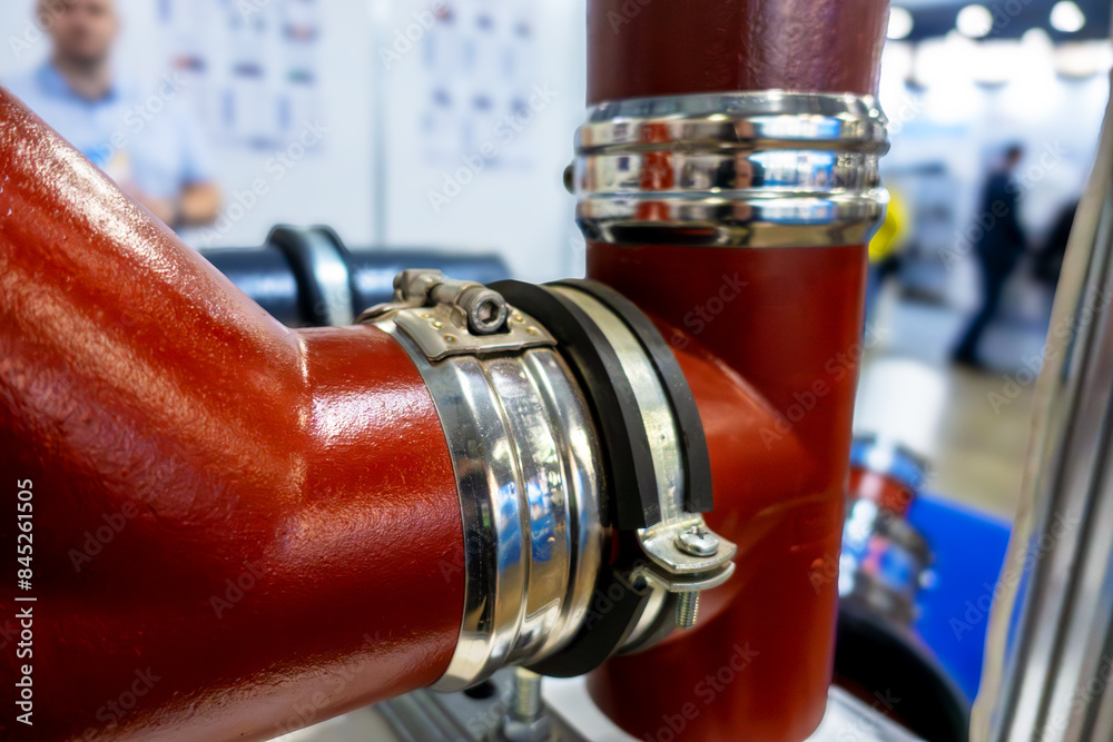 Sample of industrial red pipe with clamps and repair clamps. Stock ...