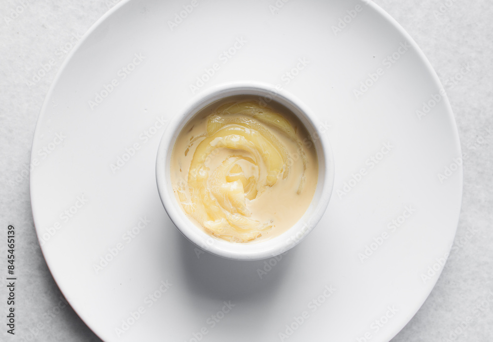 Overhead view of nigerian akamu with milk, pap akamu or ogi in a white ...