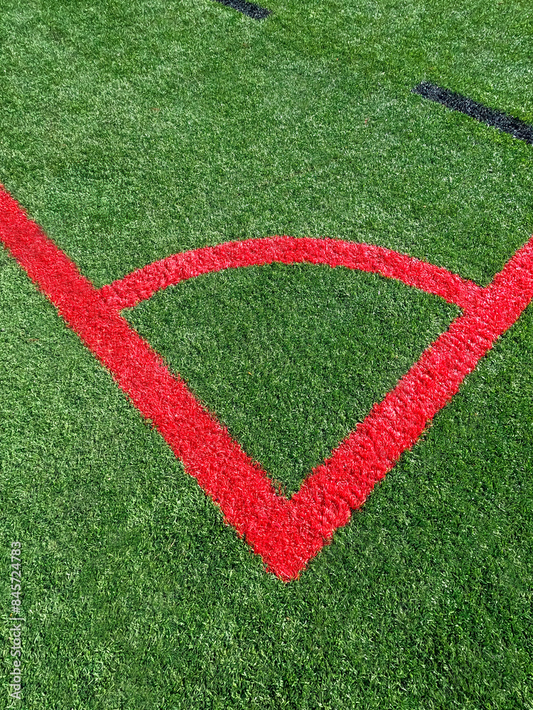 Red Corner Lines on Green Turf Sports Field. Red boundary markings on a ...