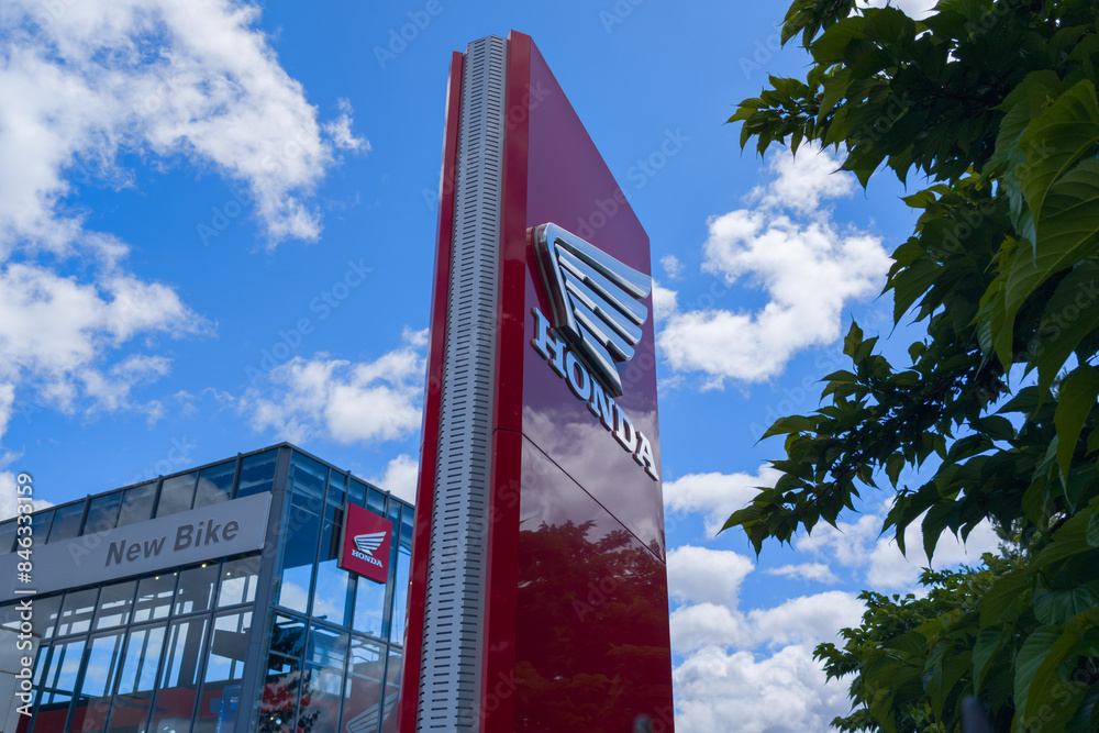 Honda motorcycles dealership brand logo and text sign front of ...