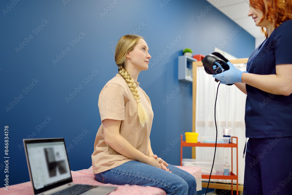 Woman with vertigo symptoms is on appointment of neurologist. Doctor ...