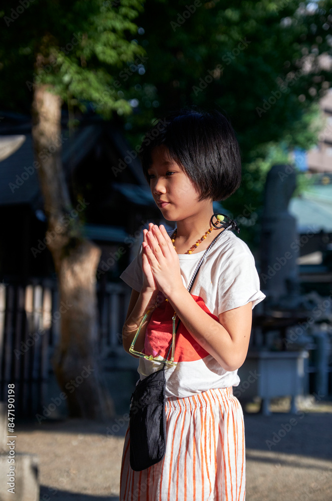 Asian girl and daughter praying in Japanese temple Stock Photo | Adobe ...