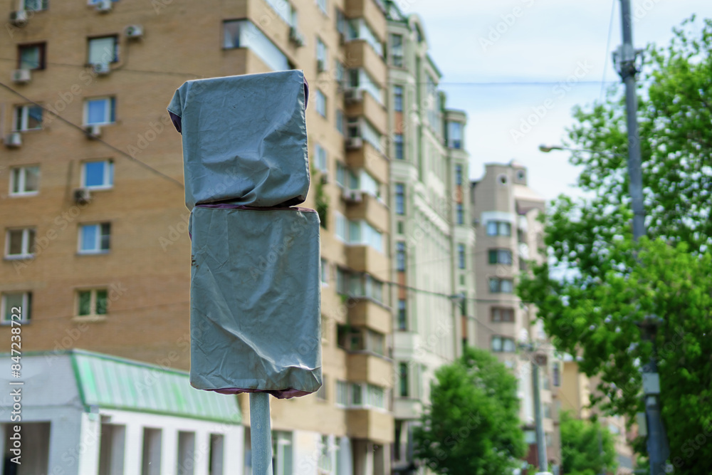 Traffic signs temporarily covered with special sleeves, indicating ...
