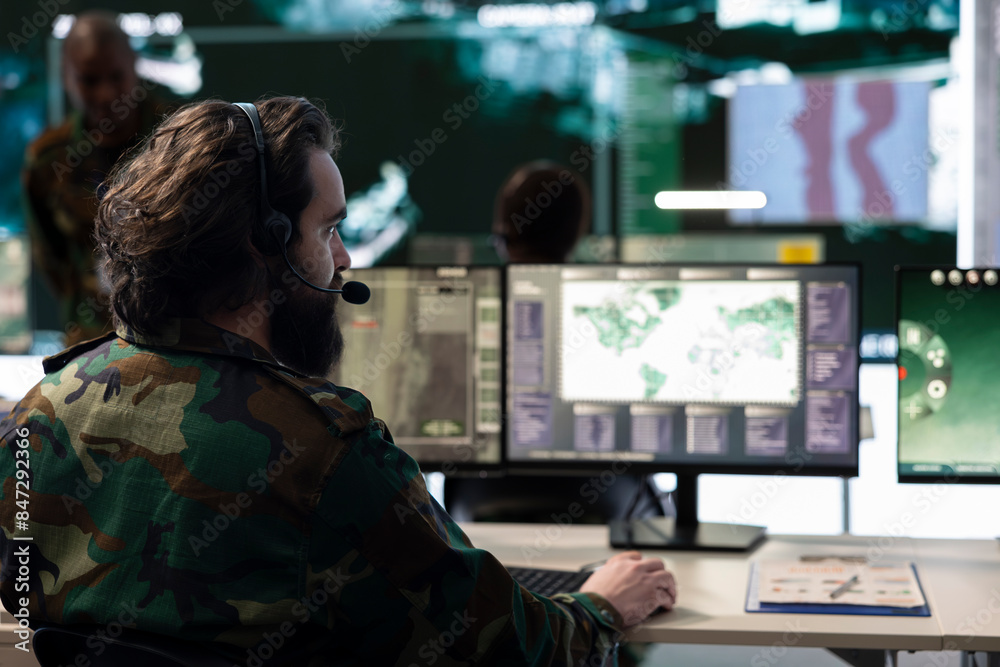 Military staff monitoring real time battlefield operation from CCTV ...