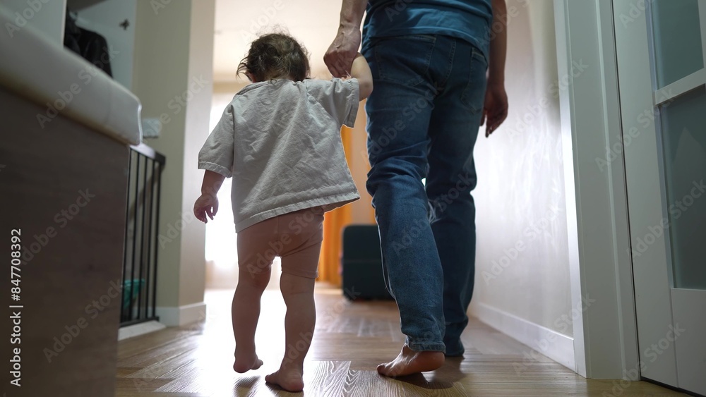 baby first steps with dad. happy family a kid dream concept. dad and ...