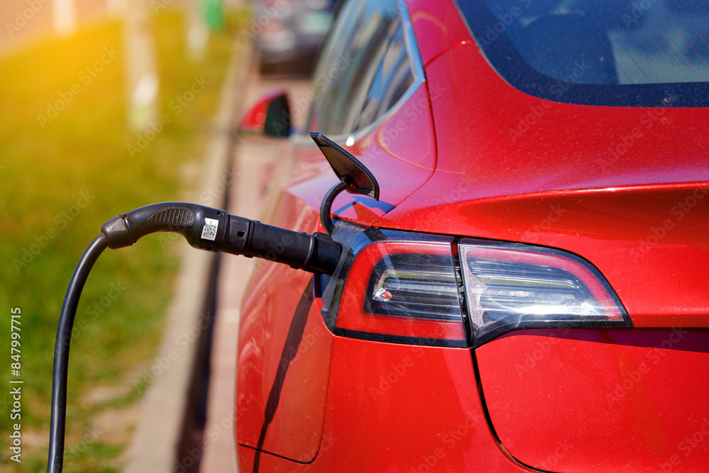 Minsk, Belarus. May 11, 2024. Electric vehicle charging closeup: Tesla ...