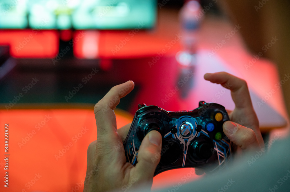 Game joystick in your hands, Keyboards and Mouse. Back view of young ...