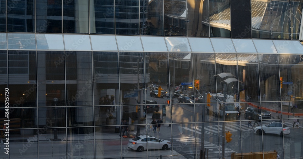 Glass building reflects vibrant modern city with highrise structures ...