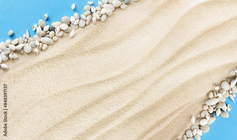 summer background of beach sand with small shells and stones on the ...