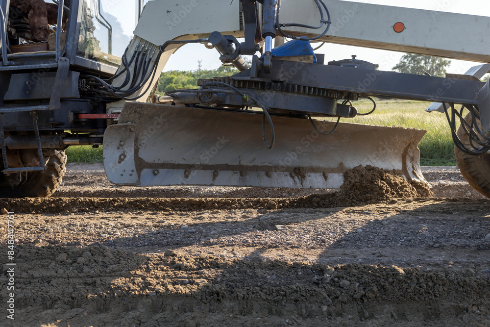 Grader industrial machine on the construction of new roads. the blade ...