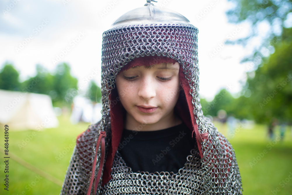 а boy in the ring of the middle ages on a holiday, a child actor in the ...