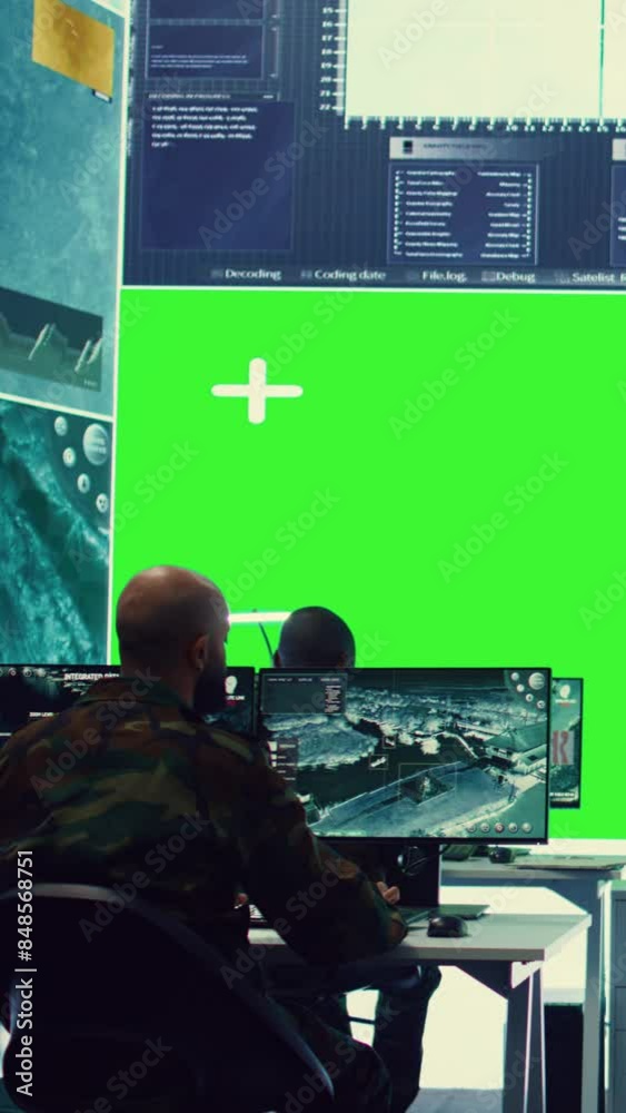 Vertical Video Diverse group of privates operating on a big screen ...