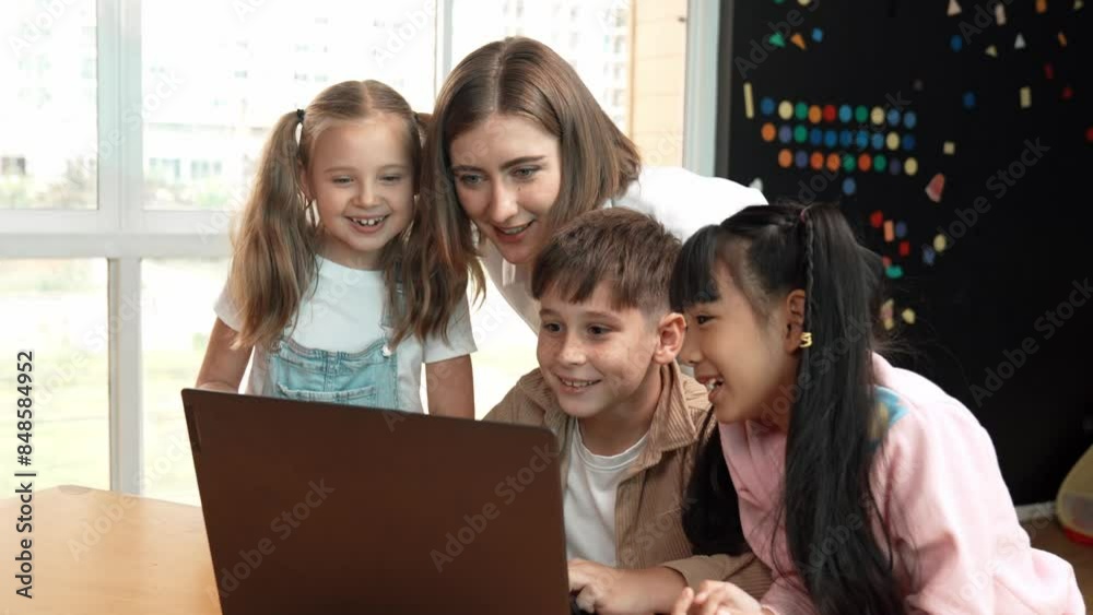 Caucasian teacher looking at african learner work or presentation ...