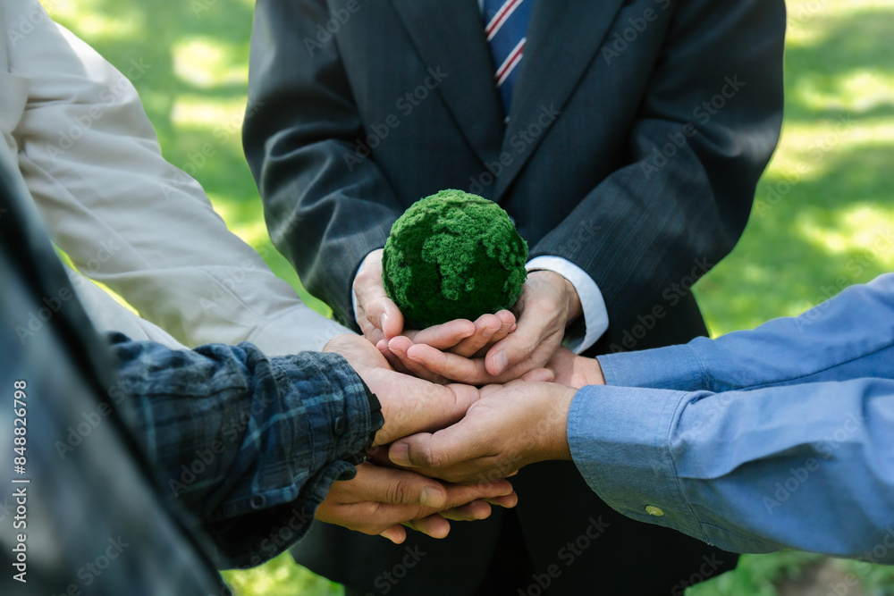 Group of business hands holding green globe for CSR, corporate social ...