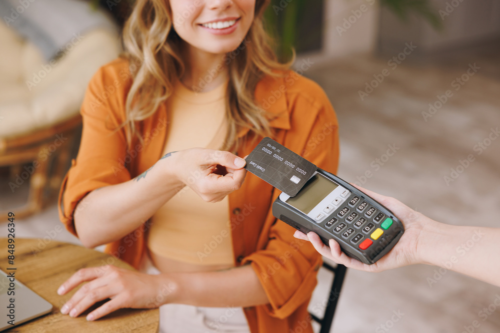 Cropped woman hold bank payment terminal to process acquire credit card ...