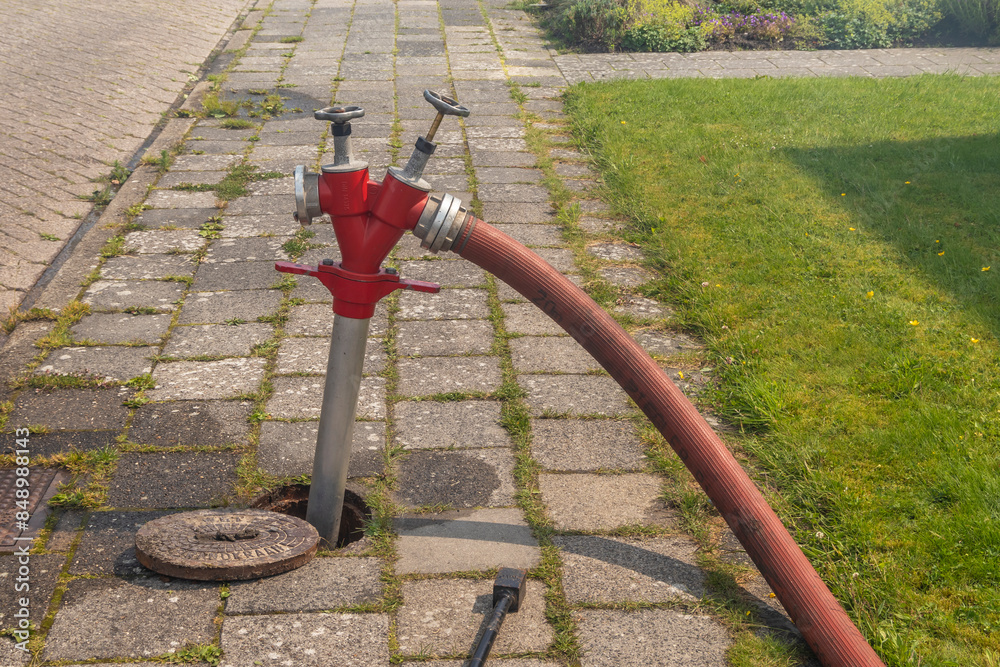 Underground hydrant in sidewalk with opened metal cover , hydrant riser ...