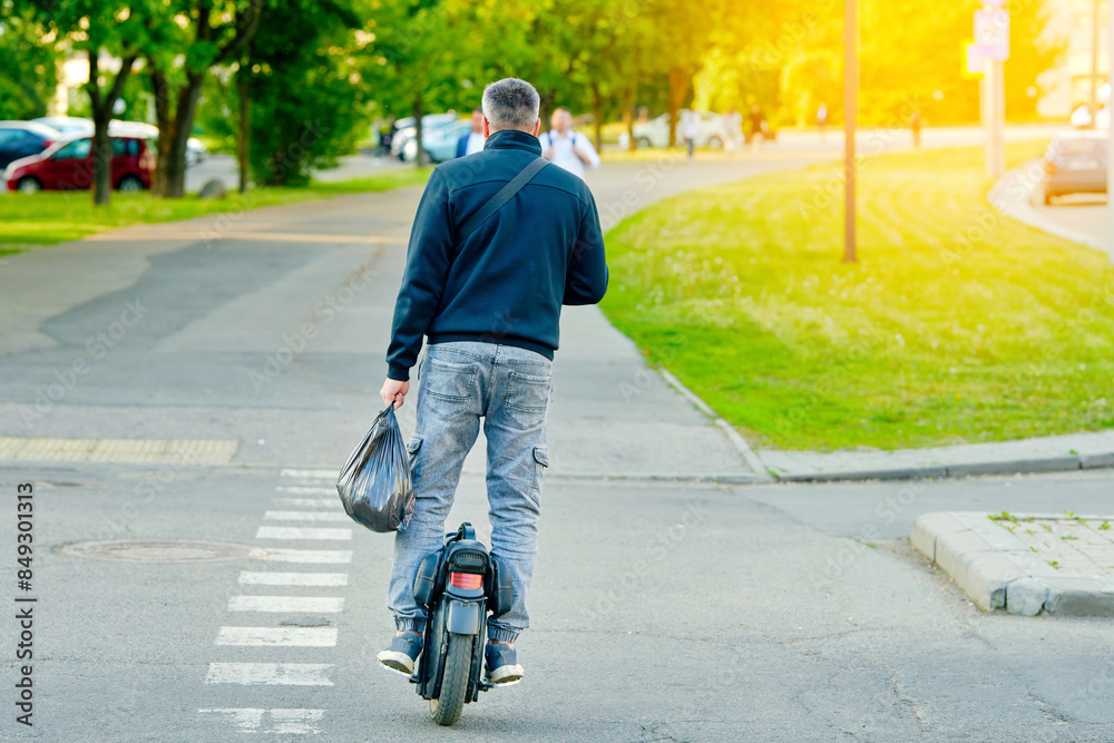 Man cycling on electric self balancing wheel, personal electrical ...