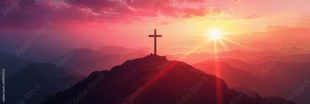 Silhouette of the cross atop Calvary mountain against the backdrop of a ...