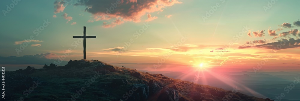 Silhouette of the cross atop Calvary mountain against the backdrop of a ...