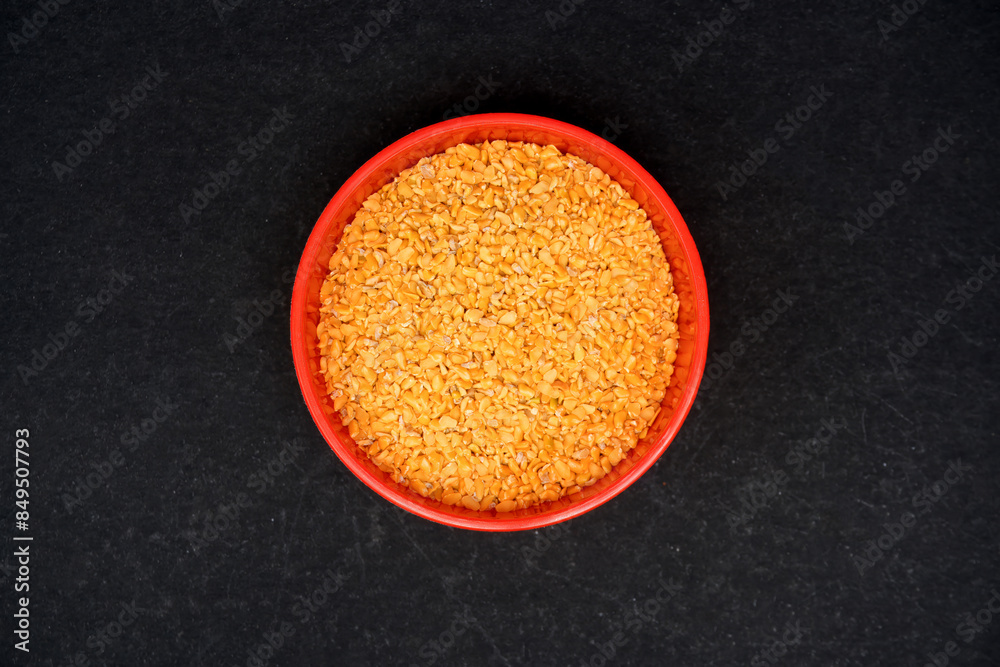 top view of Split mustard seeds, commonly referred to as Rai Kuria, are ...