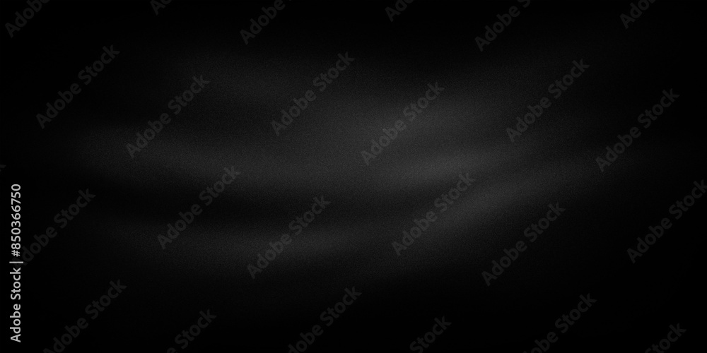 A deep black gradient with subtle shades of gray, creating a smooth and ...