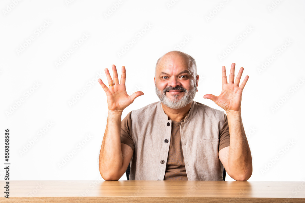 Indian asian retired old man counting numbers using fingers and showing ...