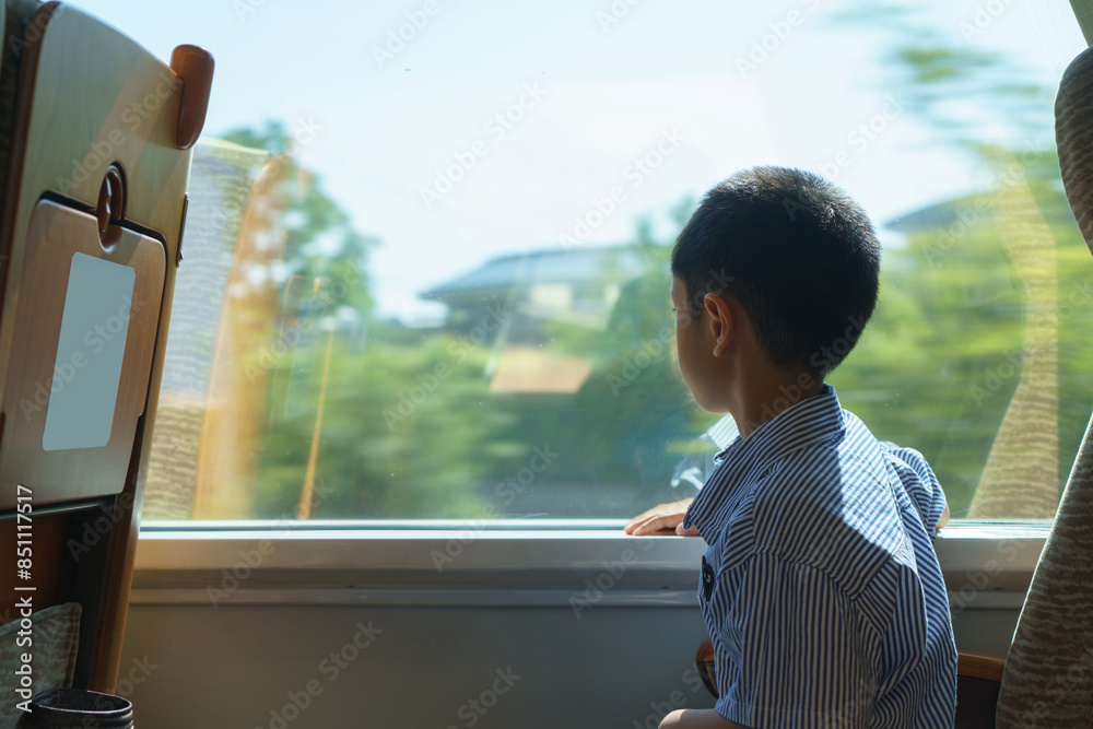 Asian Boy Watching Scenery from Train Window Stock Photo | Adobe Stock
