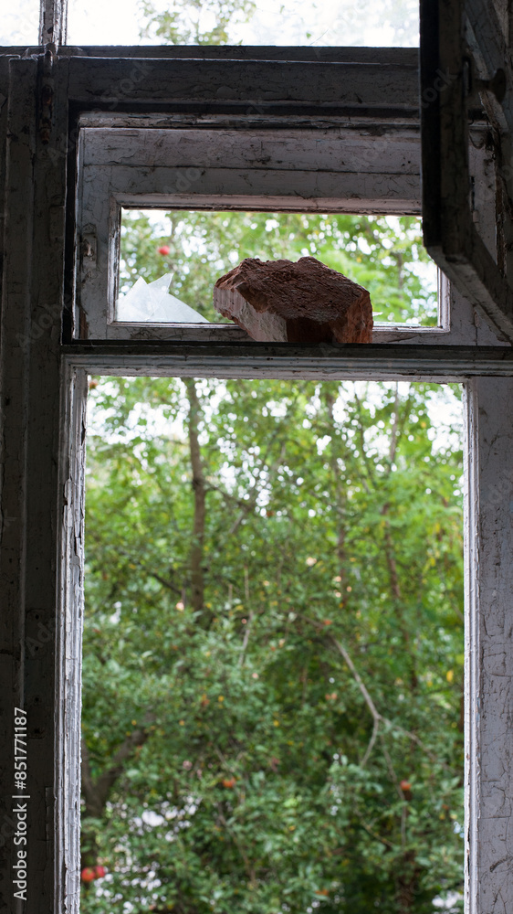Smashed glass, brick on Window with old wooden frame. old window. old ...