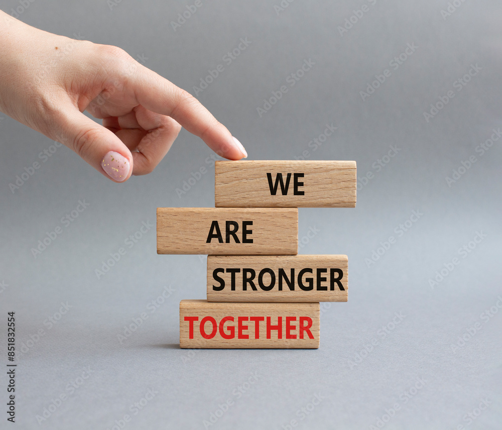 We are stronger together symbol. Wooden blocks with words We are ...